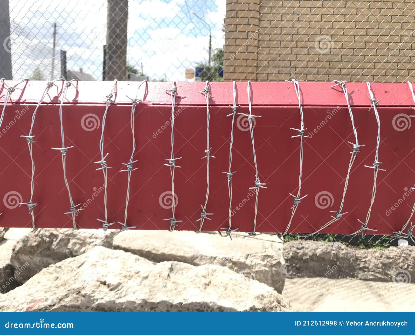 Protective Barbed Wire on a Red Background Stock Photo - Image of ...