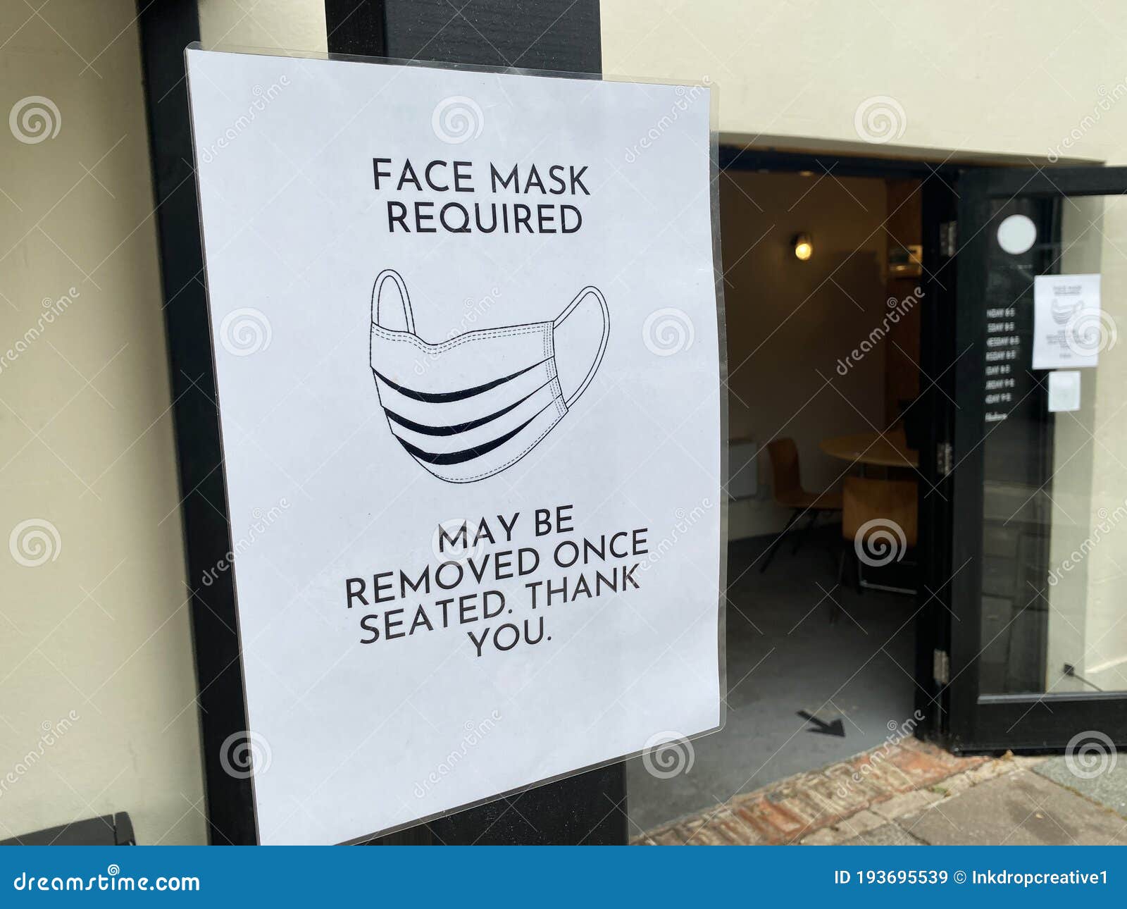 Protective Face Mask Required Sign Outside a Restaurant Stock Image ...