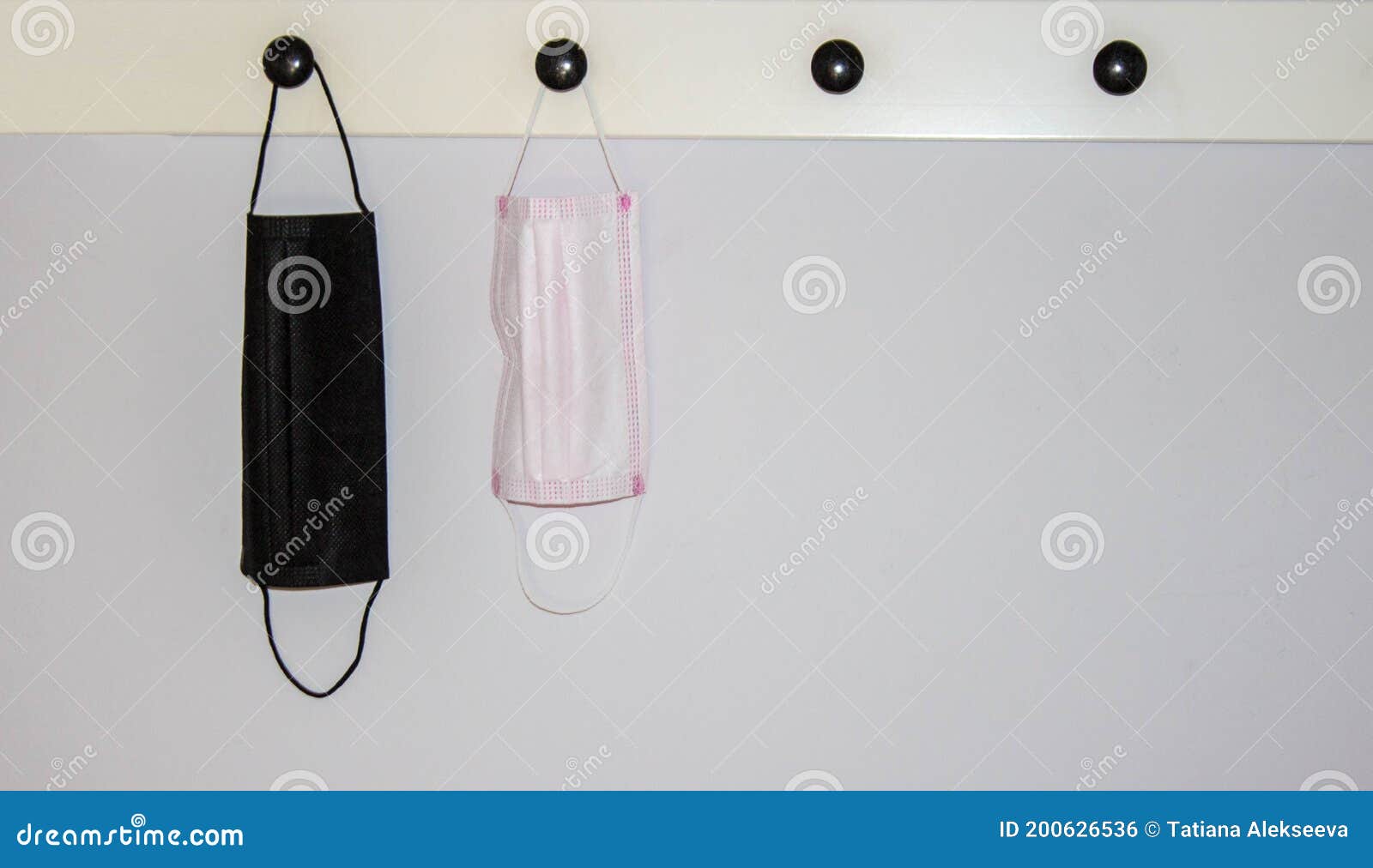 Protective Face Masks Hanging on Wall for Going Back To Work or Back To ...