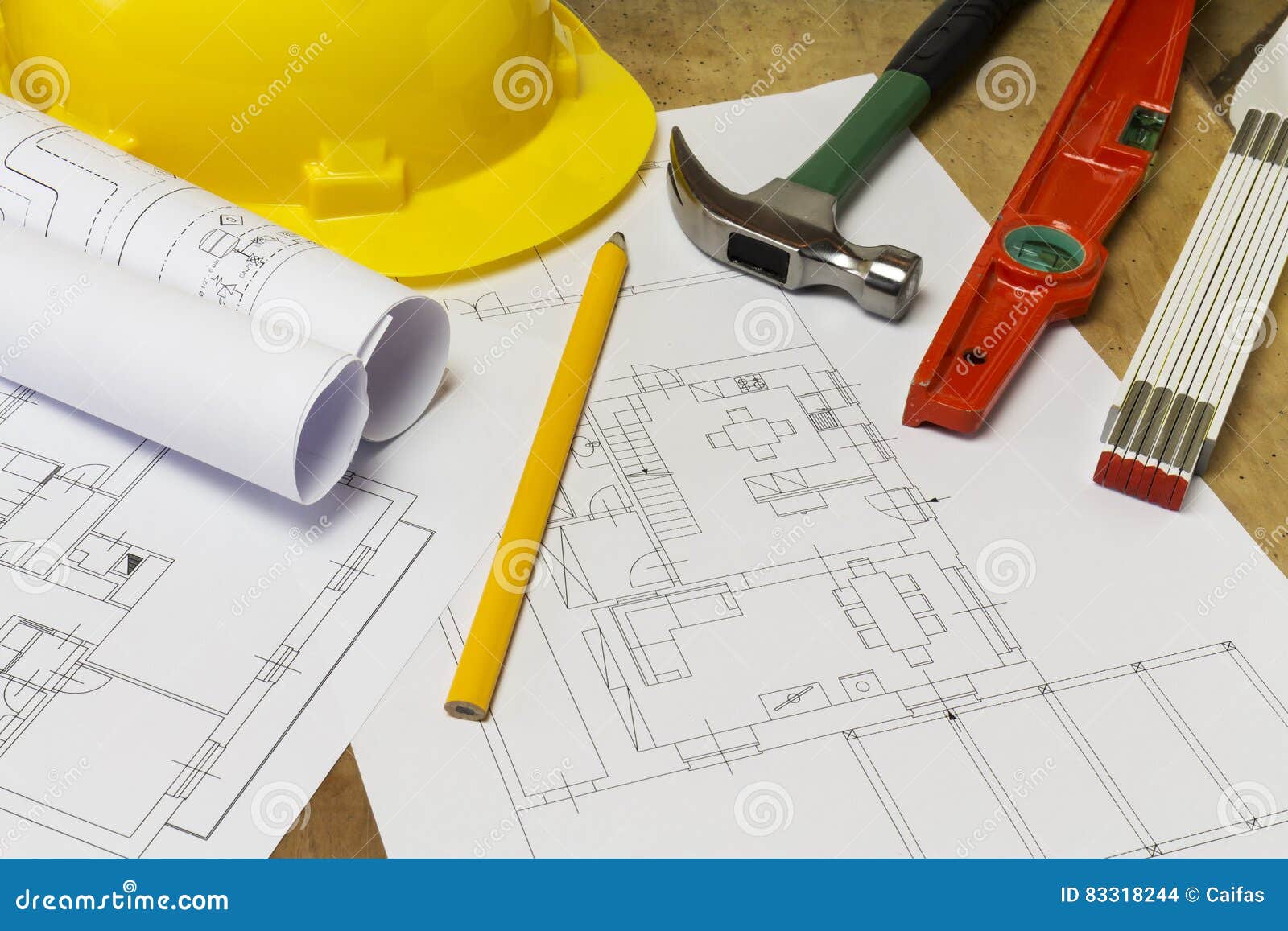 Protective Helmet, Mason Tools and Project Drawings on Wood Background ...