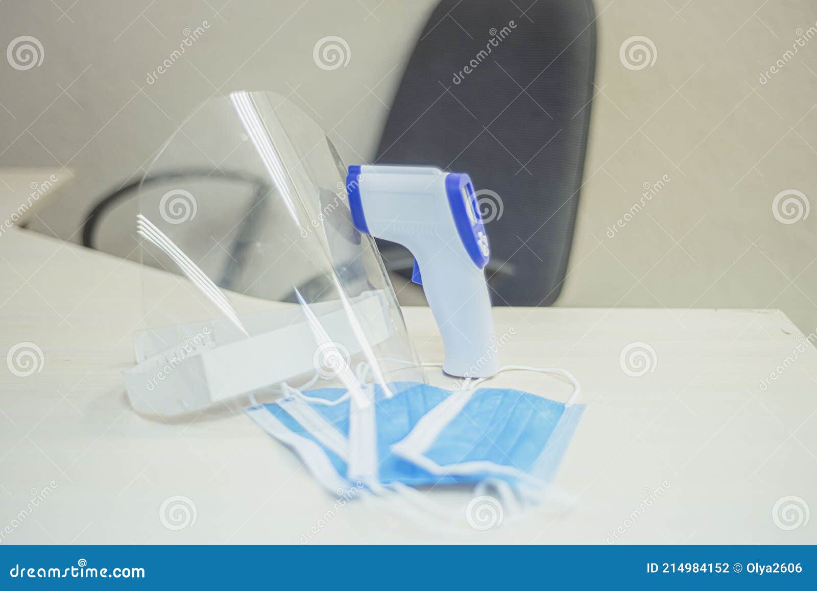 Protective Mask and Thermometer on the Table, Measure the Temperature ...