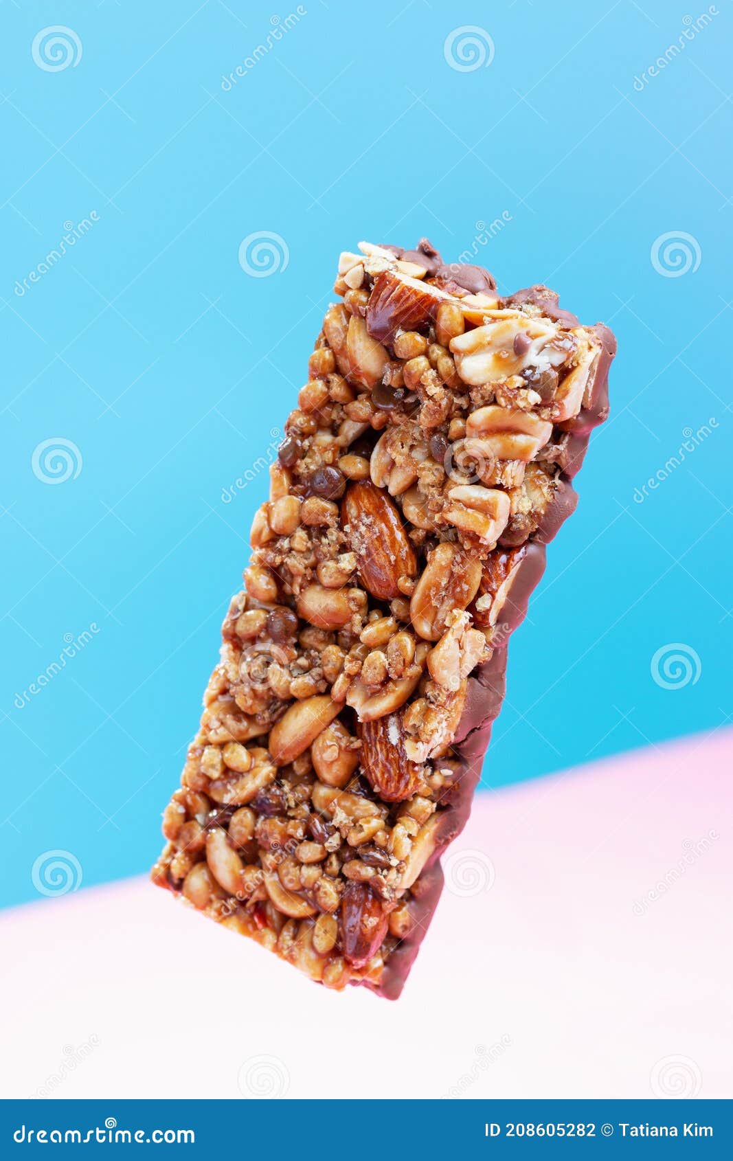 Protein Bar with Cereals on Pink and Blue Background Stock Photo ...