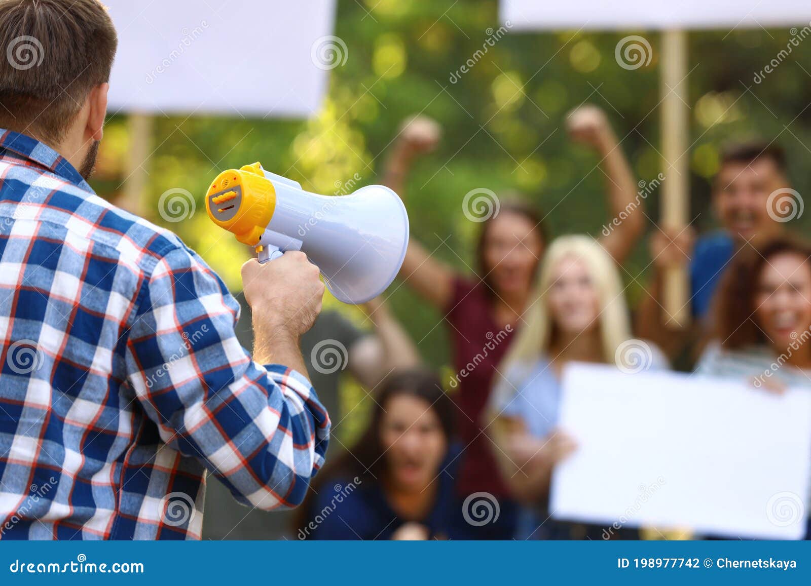 Protest Leader with Megaphone Talking To Crowd Stock Photo - Image of ... Protest Leader with Megaphone Talking To Crowd Stock Photo - Image of ...