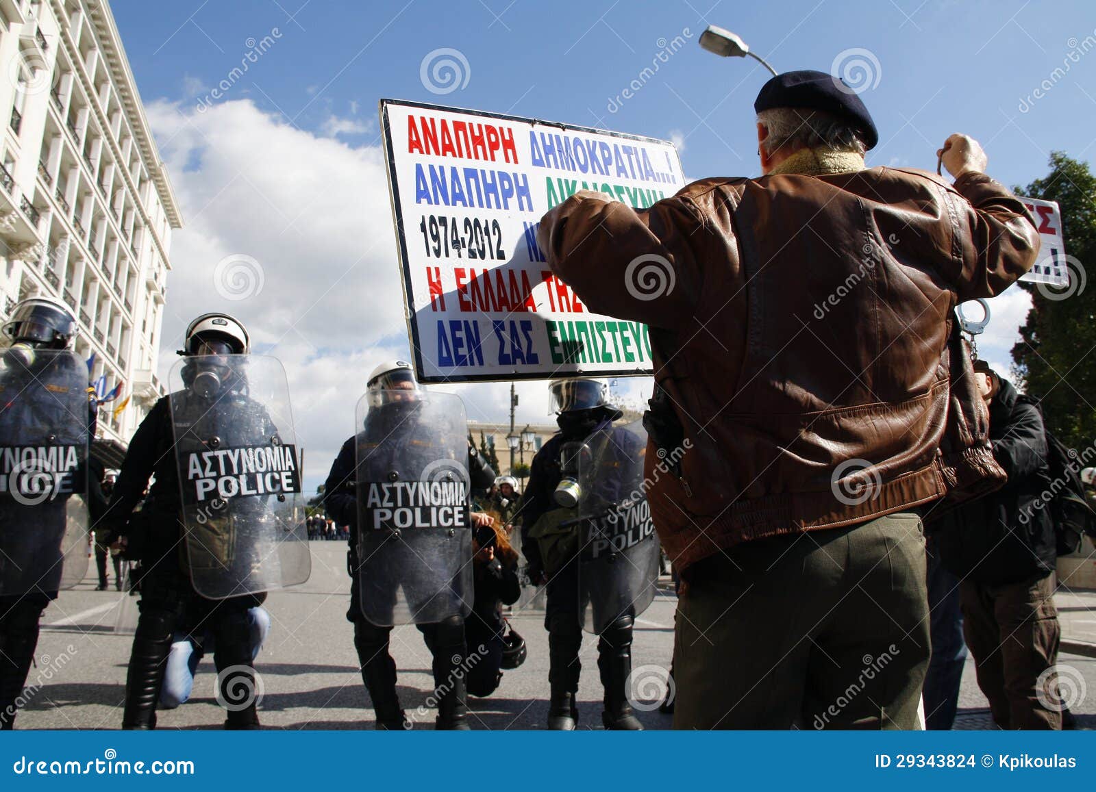 A Protester with Placards Against Riot Police Editorial Stock Image ...