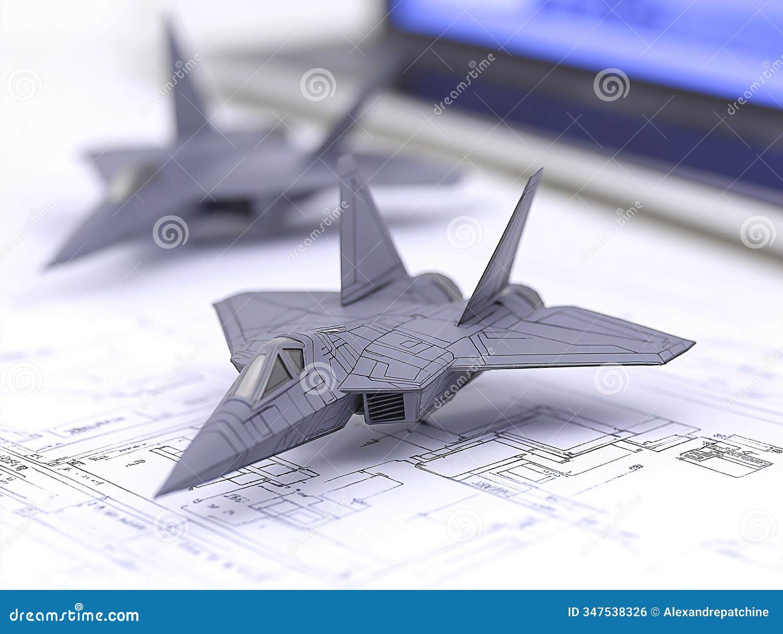 Prototype Fighter Jet Models Resting on Blueprint in Modern Engineering ...