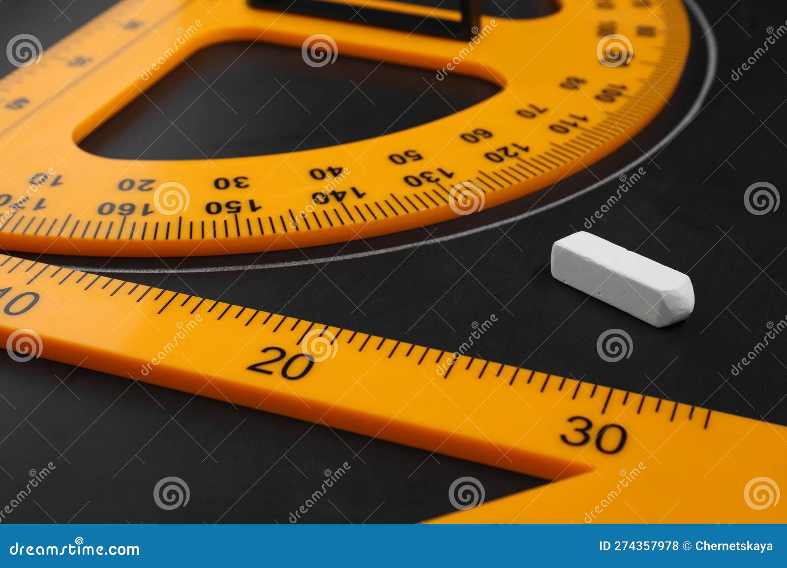 Protractor, Chalk and Triangle Ruler on Blackboard, Closeup Stock Photo ...