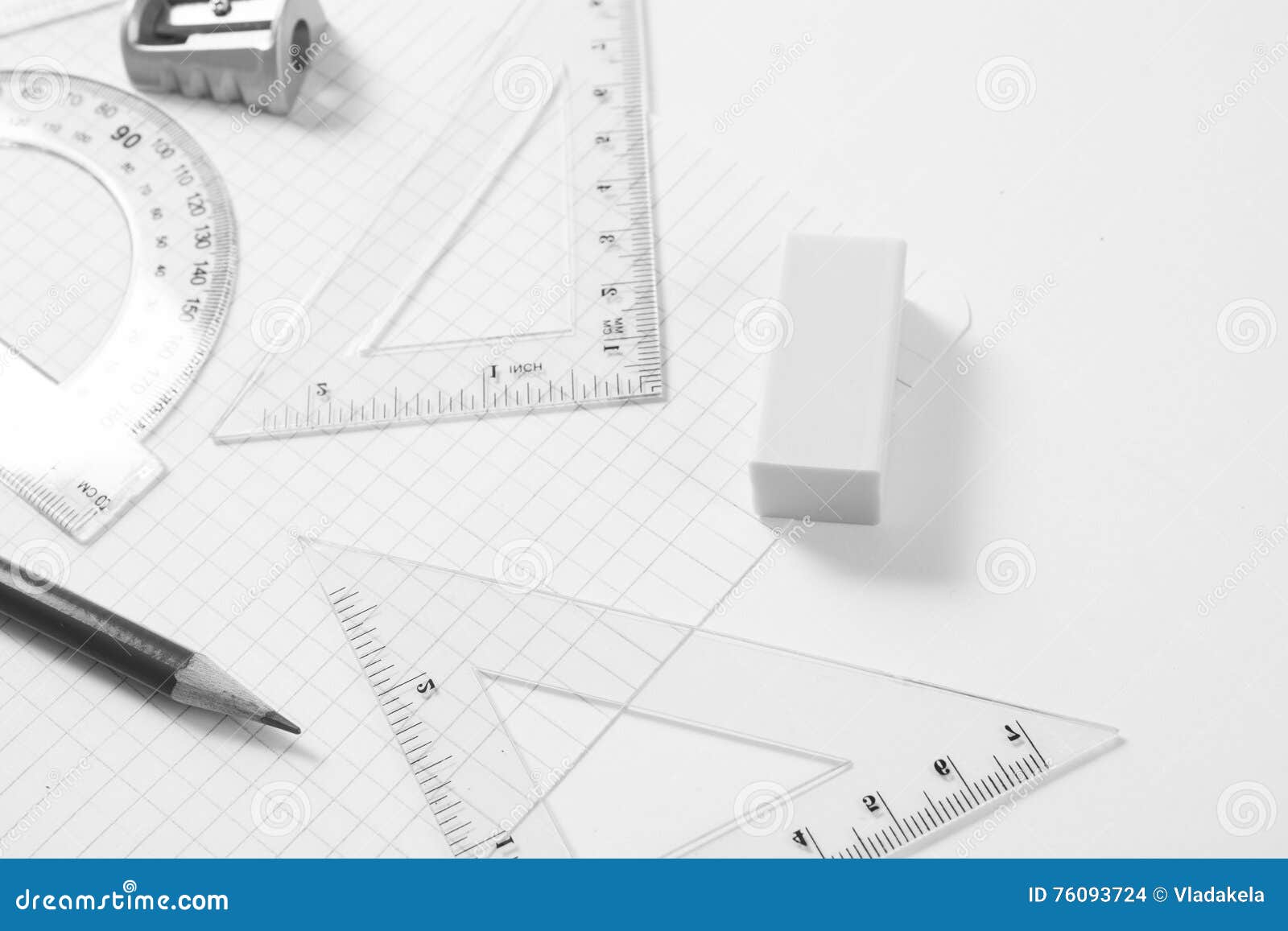 Protractor, Rulers, Pencil and Eraser on Squared Paper Stock Photo ...