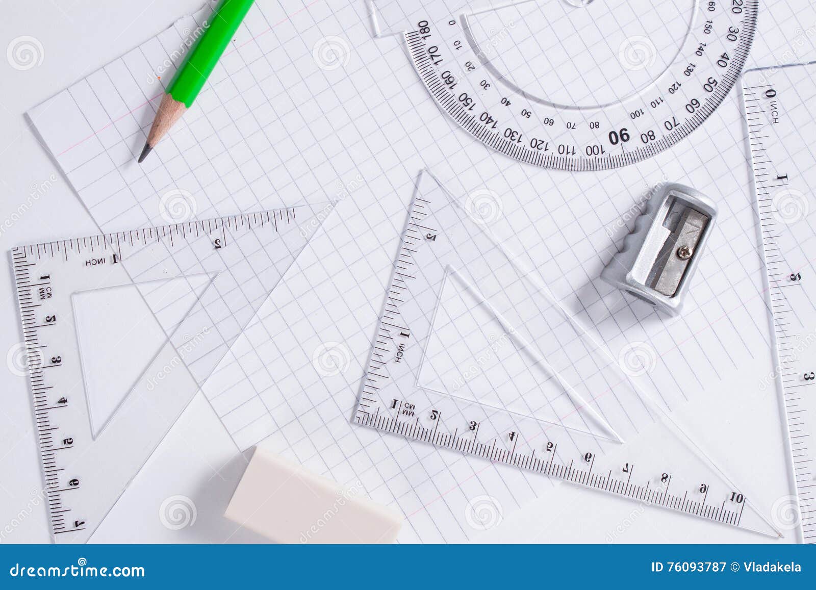 Protractor, Rulers, Pencil and Eraser on Squared Paper Stock Image ...