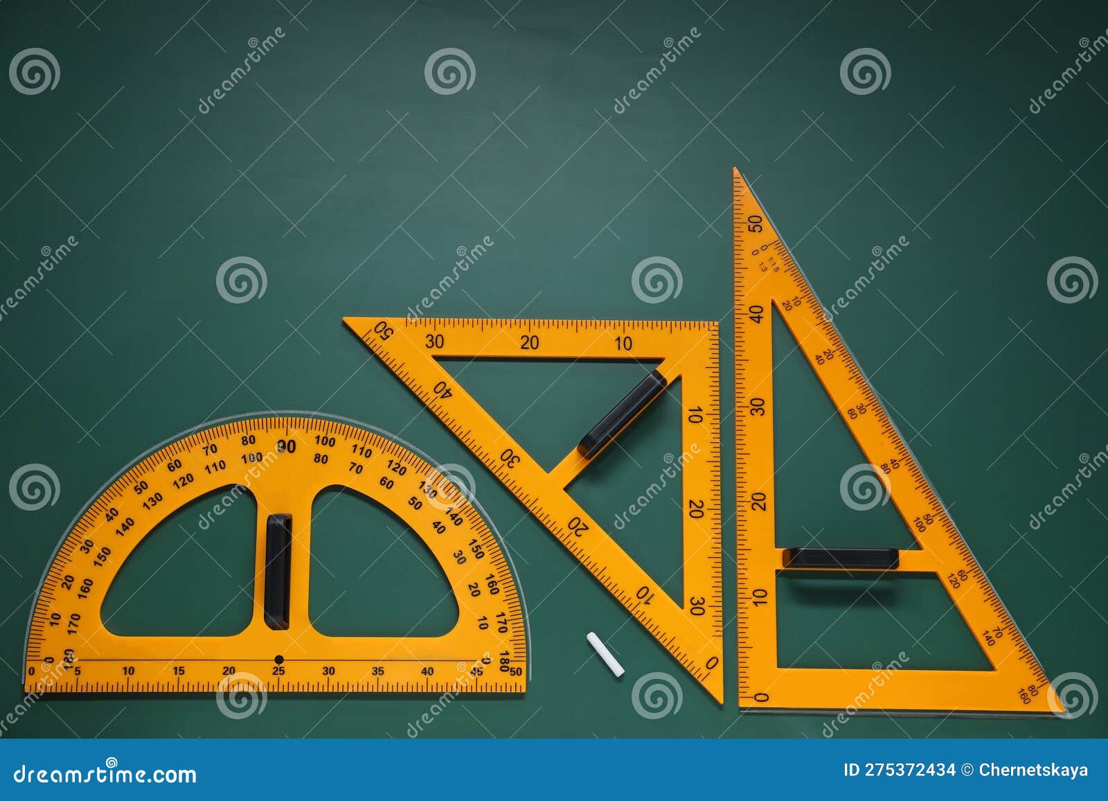 Protractor, Triangles and Chalk on Green Chalkboard, Flat Lay Stock ...