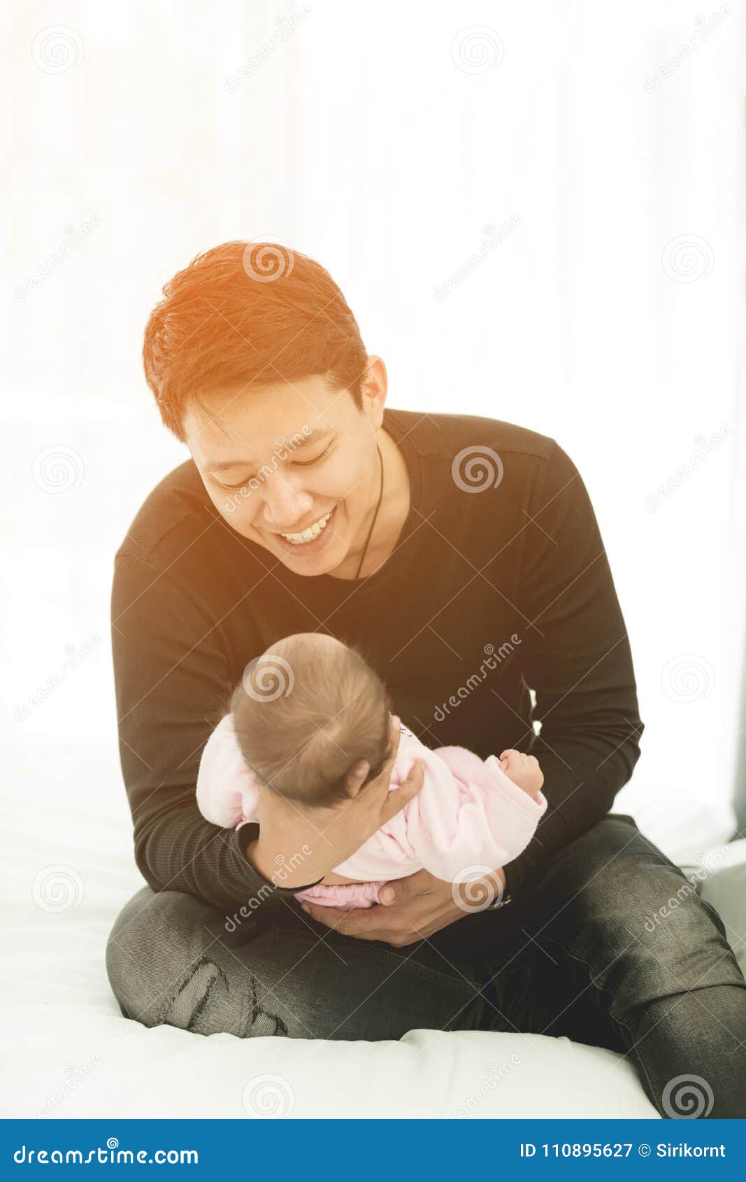Proud Asian Father Holding His Newborn Baby at Home. Stock Image ... Proud Asian Father Holding His Newborn Baby at Home. Stock Image ...