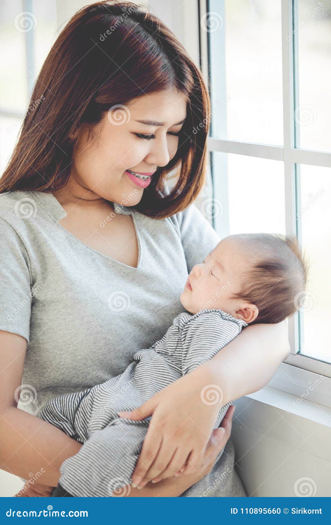 Proud Asian Father Holding His Newborn Baby at Home. Stock Photo ... Proud Asian Father Holding His Newborn Baby at Home. Stock Photo ...