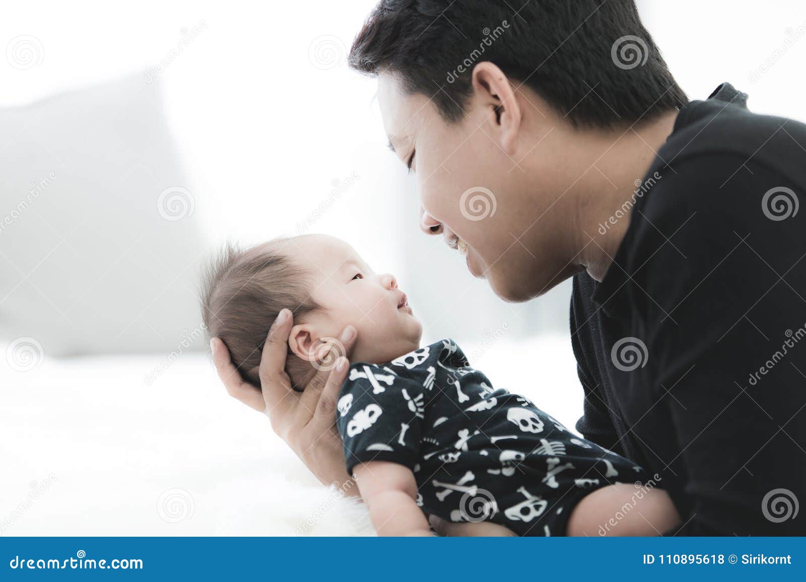 Proud Asian Father Holding His Newborn Baby at Home. Stock Photo ... Proud Asian Father Holding His Newborn Baby at Home. Stock Photo ...