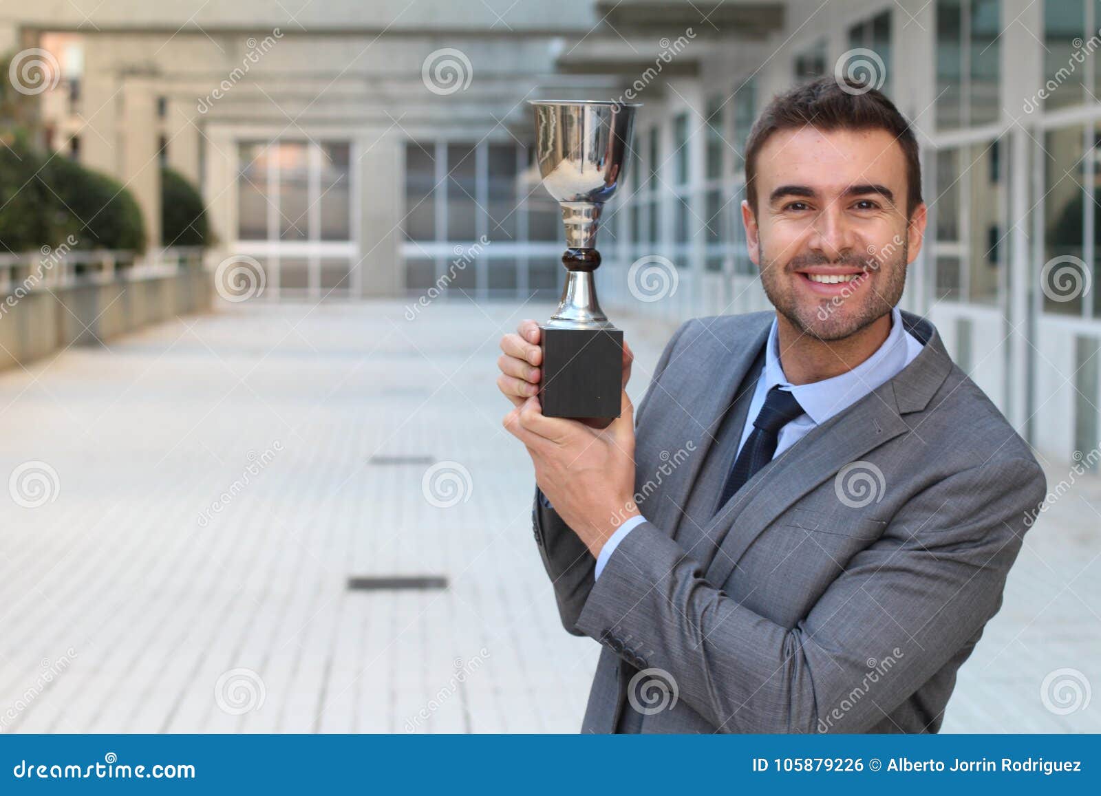 Proud Businessman Holding His Trophy Stock Photo - Image of male ... Proud Businessman Holding His Trophy Stock Photo - Image of male ...