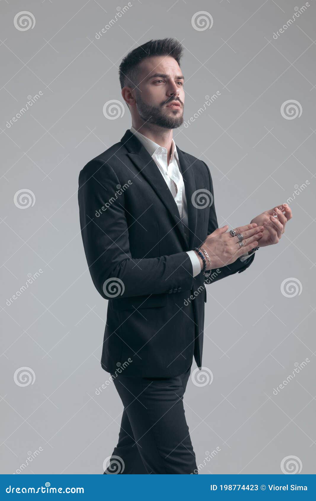 Proud Elegant Man Clapping and Looking Away Stock Image - Image of ...