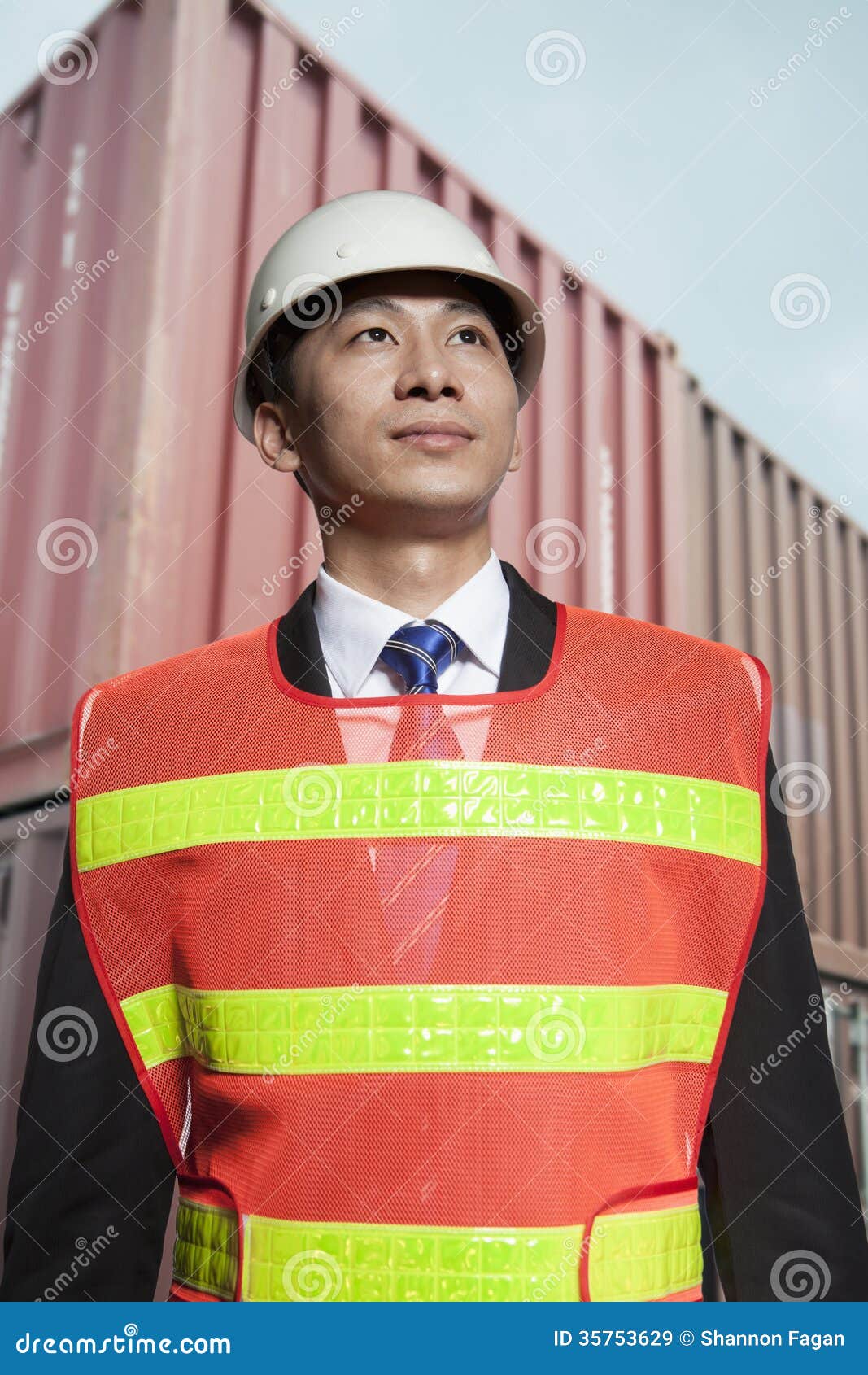Proud Engineer in Protective Workwear Standing in a Shipping Yard Stock ...