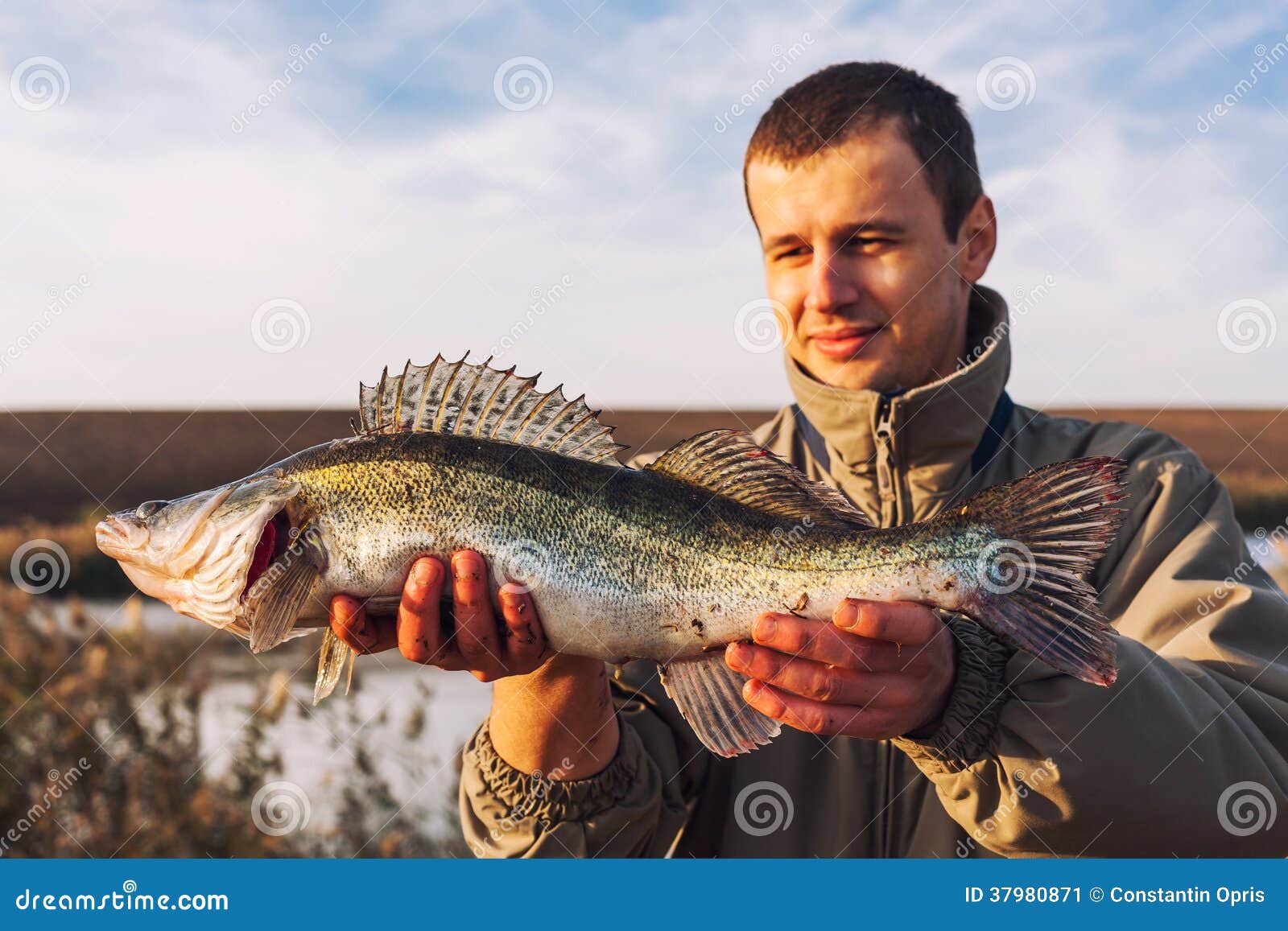 Proud fisherman with catch stock image. Image of showing - 37980871