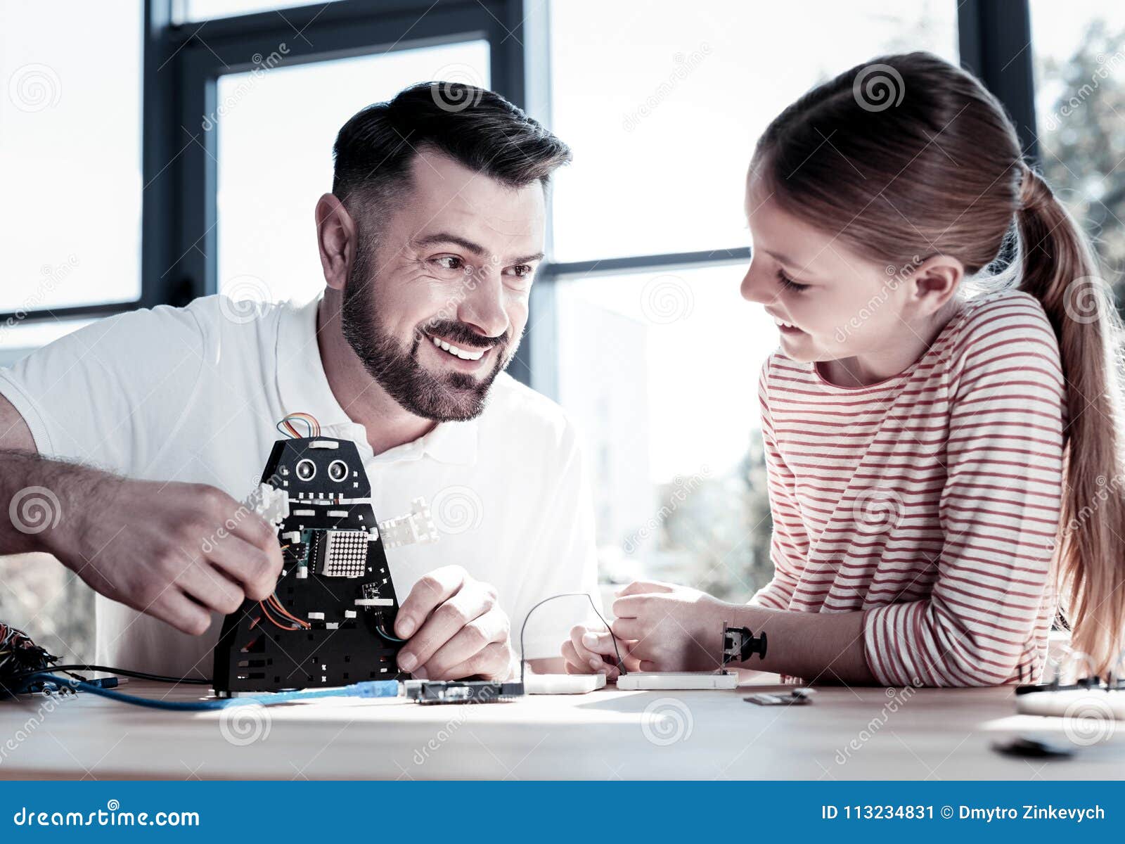 Adorable Father and Daughter Designing Robotic Machine Together Stock ...