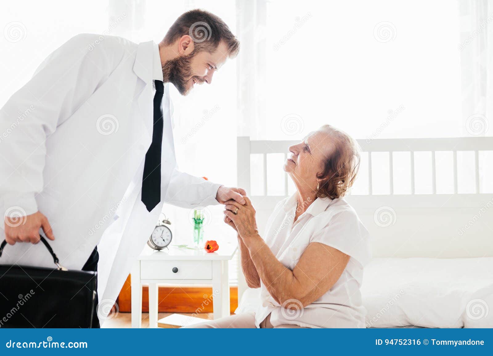 Providing Care for Elderly. Doctor Visiting Elderly Patient at Home ...
