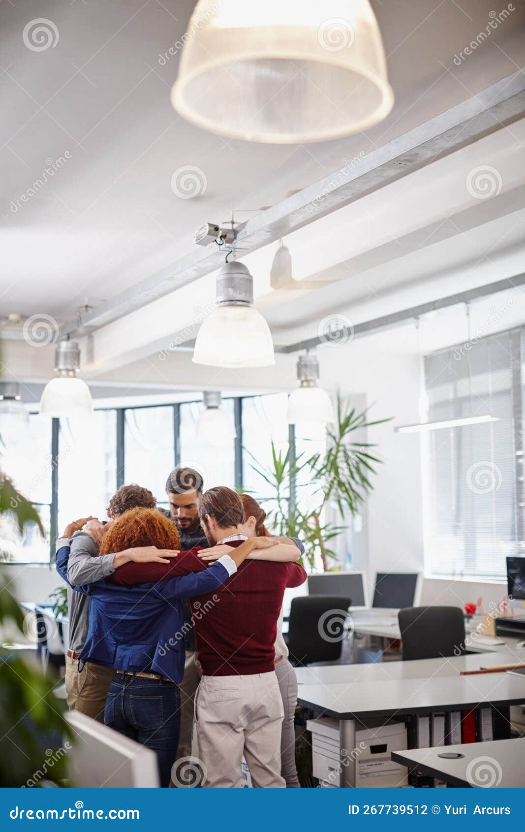 Psyching Themselves Up for the Next Challenge. a Team of Businesspeople ...