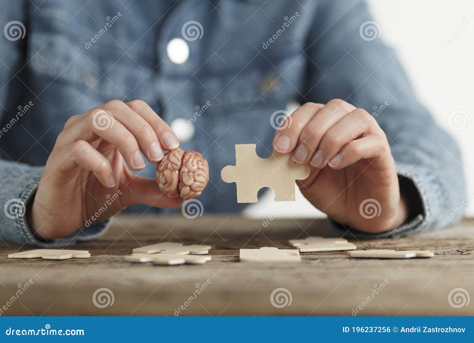 A Psychologist is Holding Human Brain and Puzzle. Problem Solving, Help ...