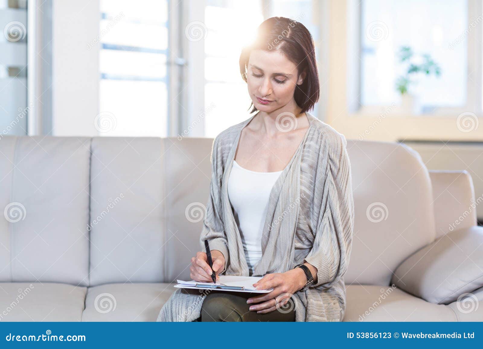 Psychologist Sitting on the Couch and Taking Notes Stock Image - Image ...