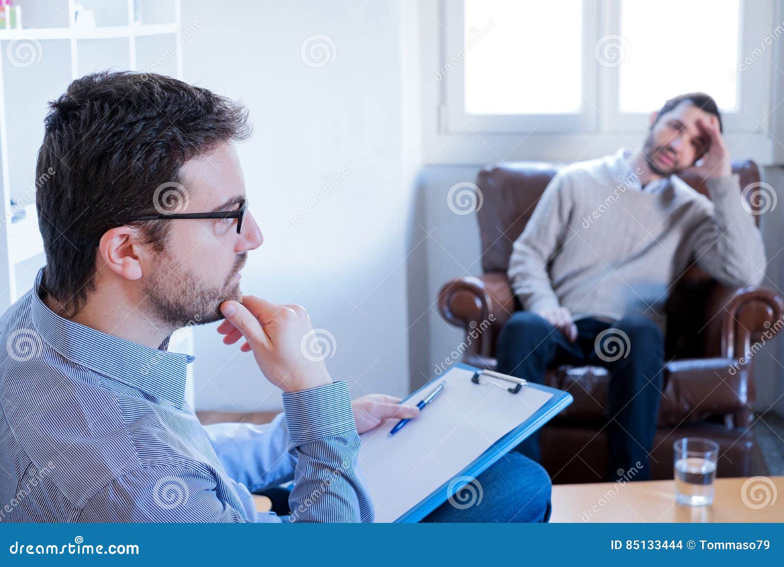 Psychologist Taking Notes during Psychotherapy Stock Photo - Image of ...