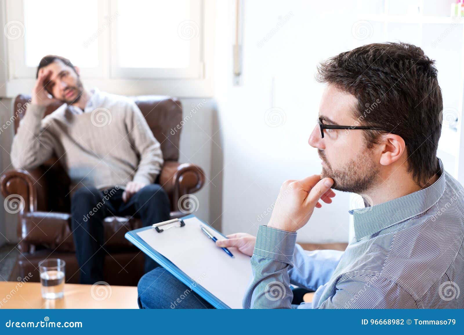 Psychologist Taking Notes during Session Stock Photo - Image of hands ...
