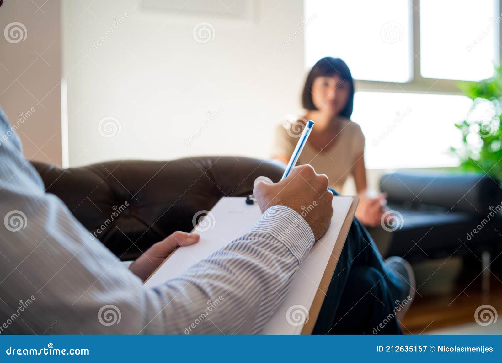 Psychologist Taking Notes during Therapy Session. Stock Image - Image ...
