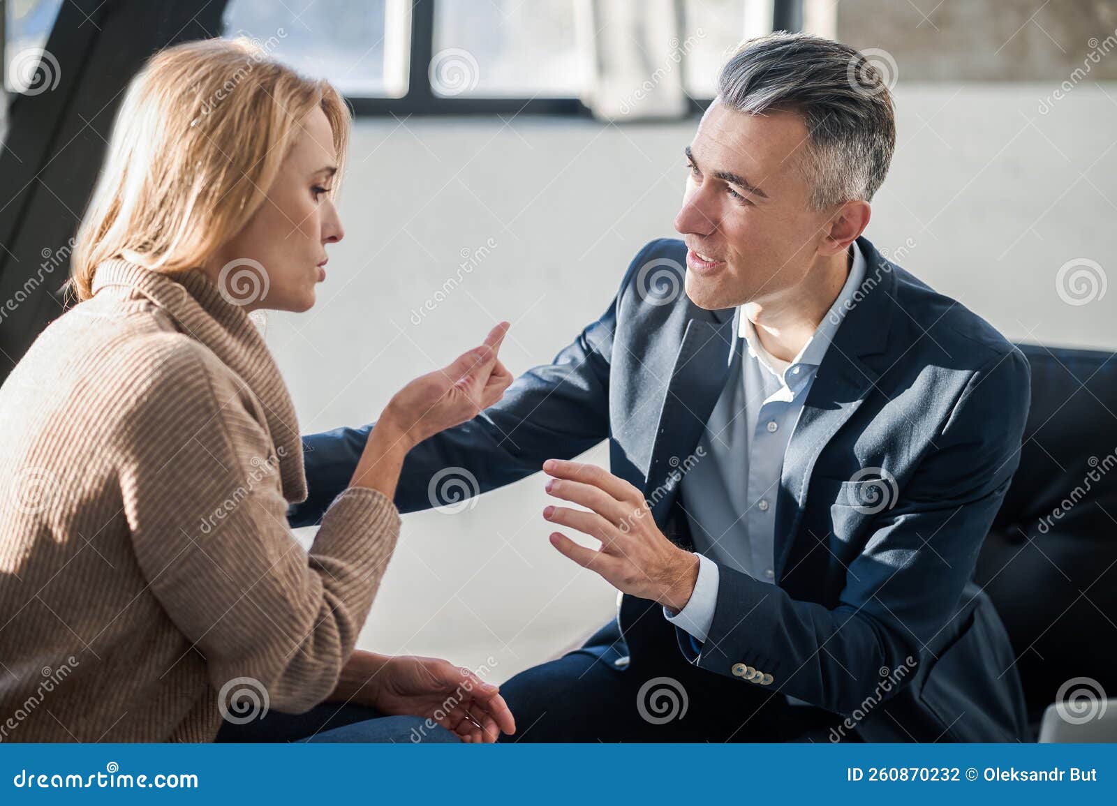 Psychologist Talking To a Client and Looking Friendly Stock Photo ...