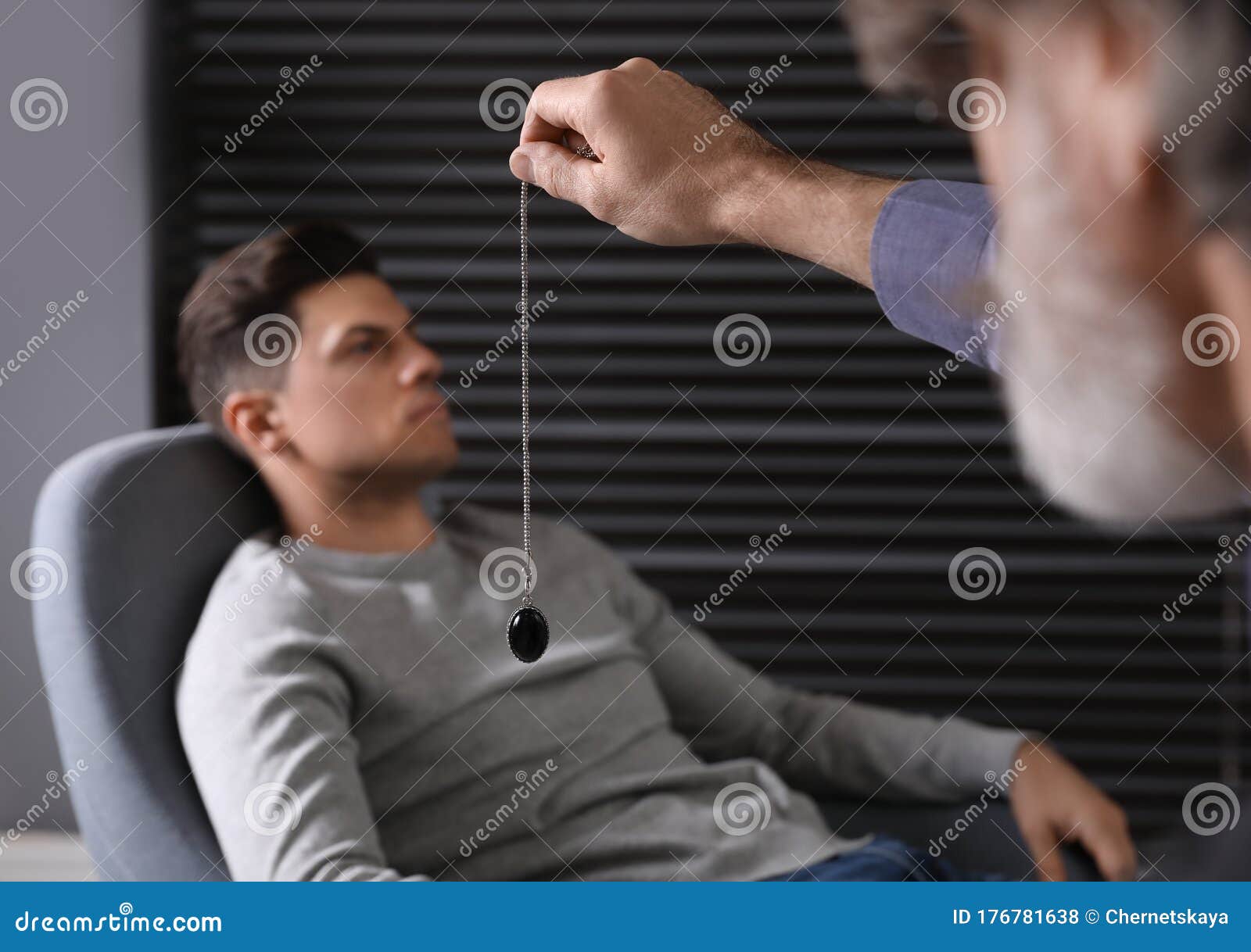 Psychotherapist Using Pendulum during Hypnotherapy Session Stock Photo ...