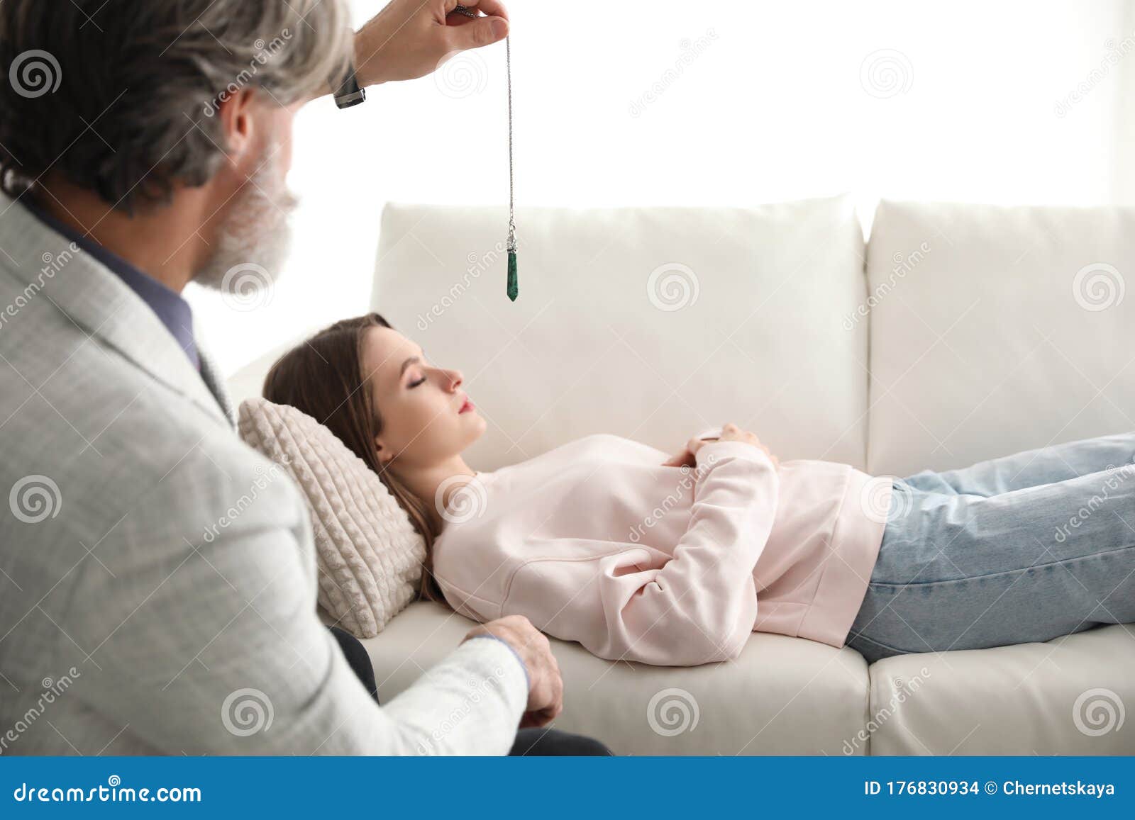 Psychotherapist Using Pendulum during Hypnotherapy Session Stock Photo ...