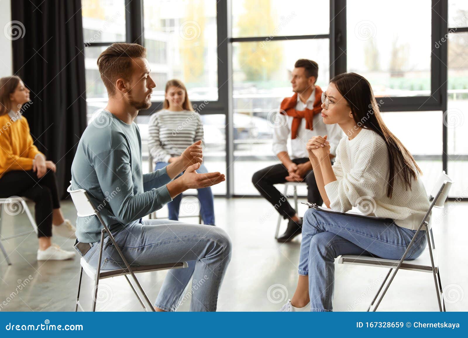 Psychotherapist Working with Patient in Group Therapy Session Stock ...