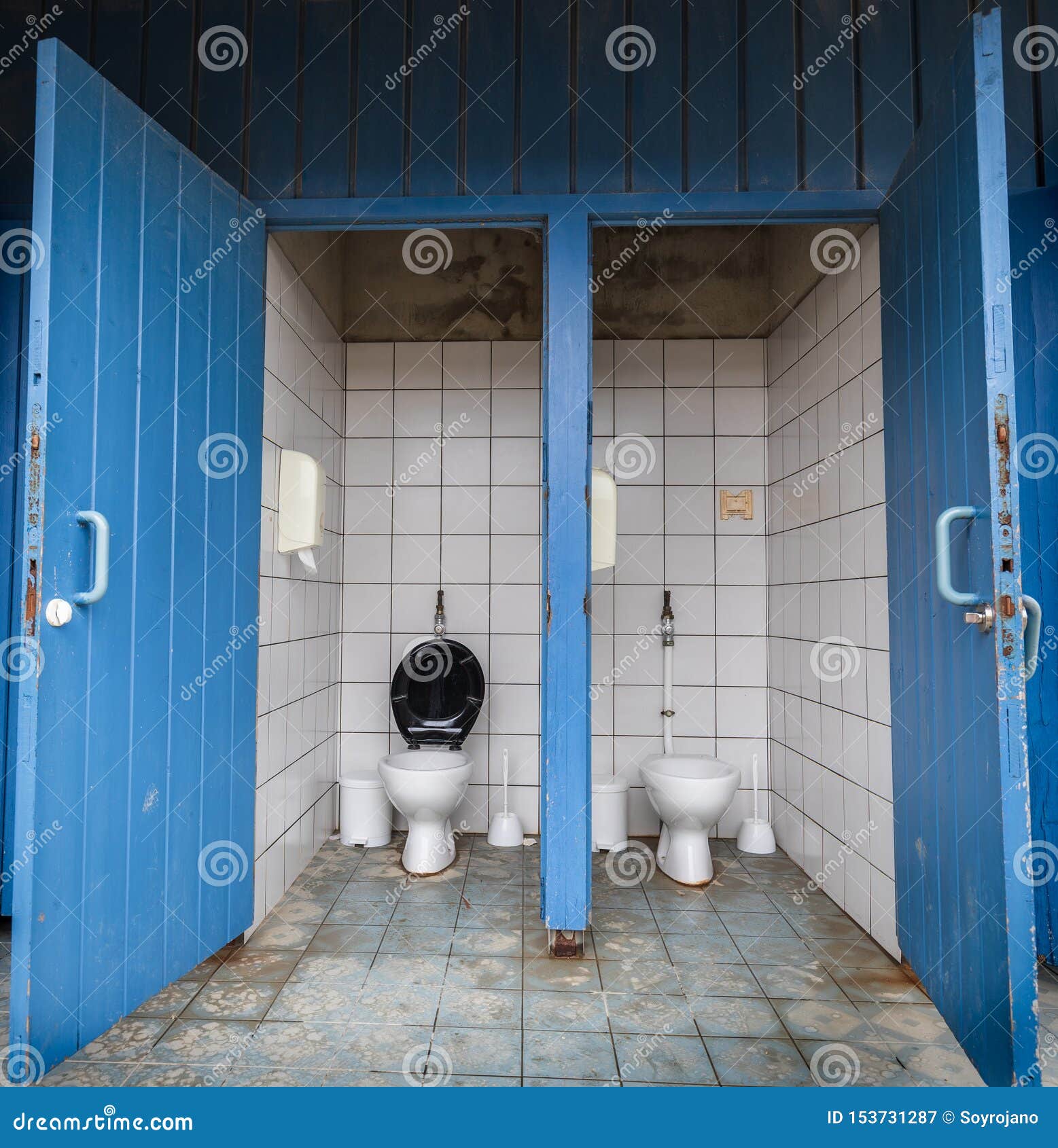 Public Bathroom with Blue Open Doors Stock Image - Image of empty ...