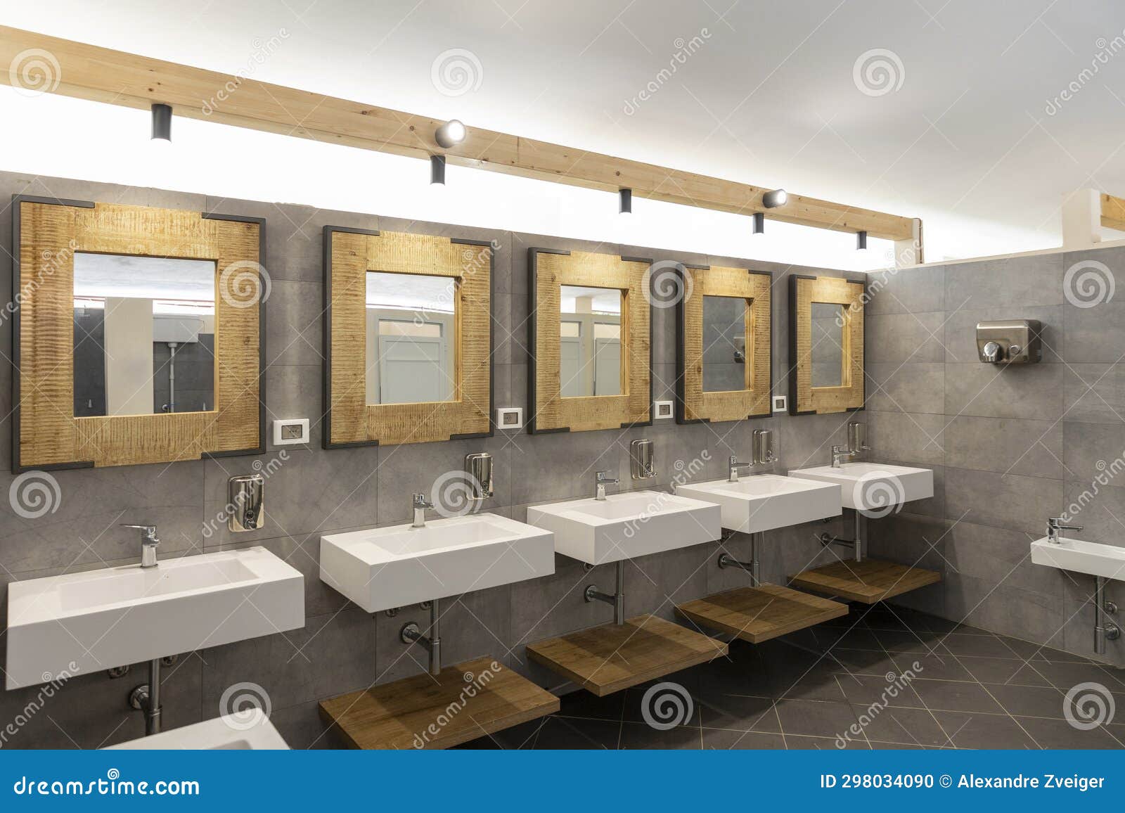 Public Bathroom With Five Sinks, Mirrors And Soap Dispensers. Modern ...