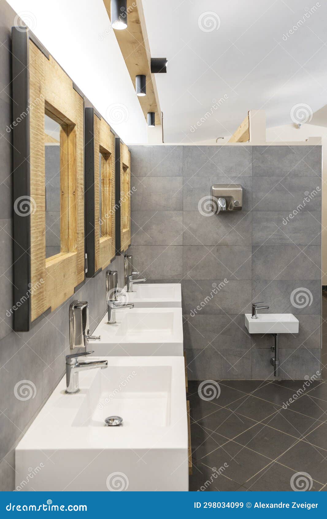 Three Sinks Of Different Heights In A Public Toilet Royalty-Free Stock ...