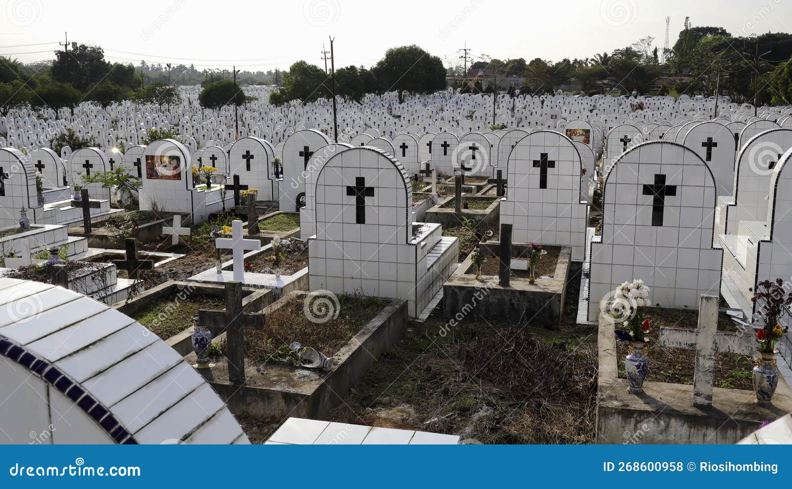 The Public Cemetery Contains Identical White Ceramic Graves with ...