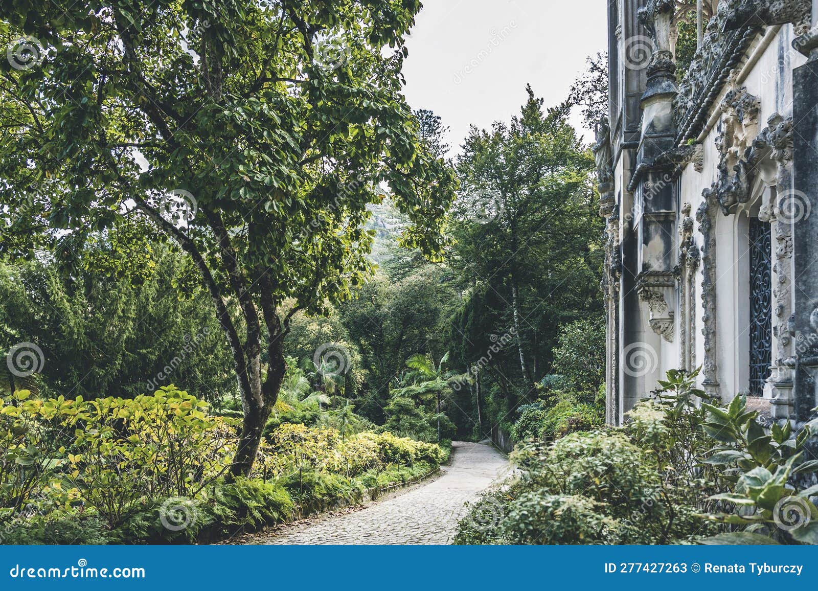 Public Park with Cobblestone Pathway. Old Building and Trees Around ...