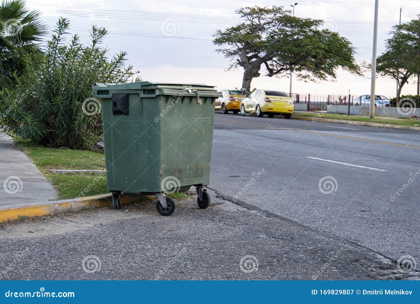 Public Plastic Green Waste Garbage Containers on Streets of the City ...