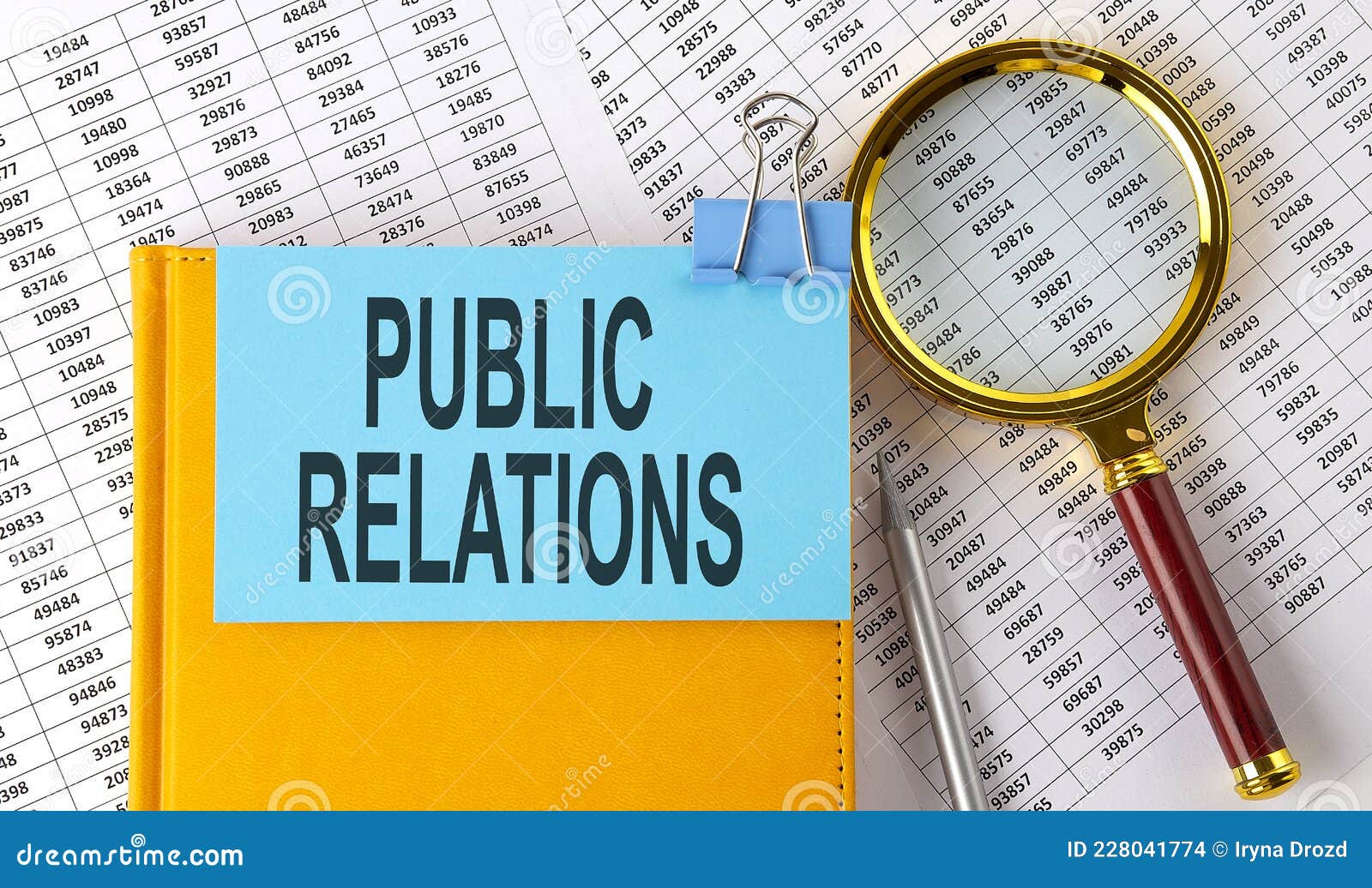 PUBLIC RELATIONS Text on Sticker on Notebook with Magnifier and Chart ...