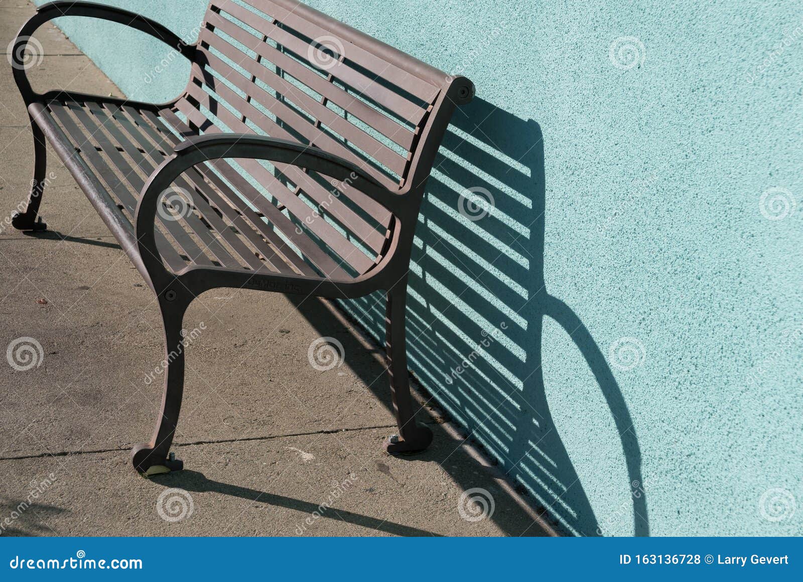 Public Sidewalk Bench, Blue Wall Stock Photo - Image of details, color ...