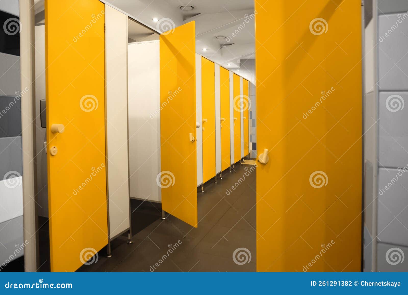 Public Toilet Interior with Bright Yellow Stalls Stock Photo - Image of ...