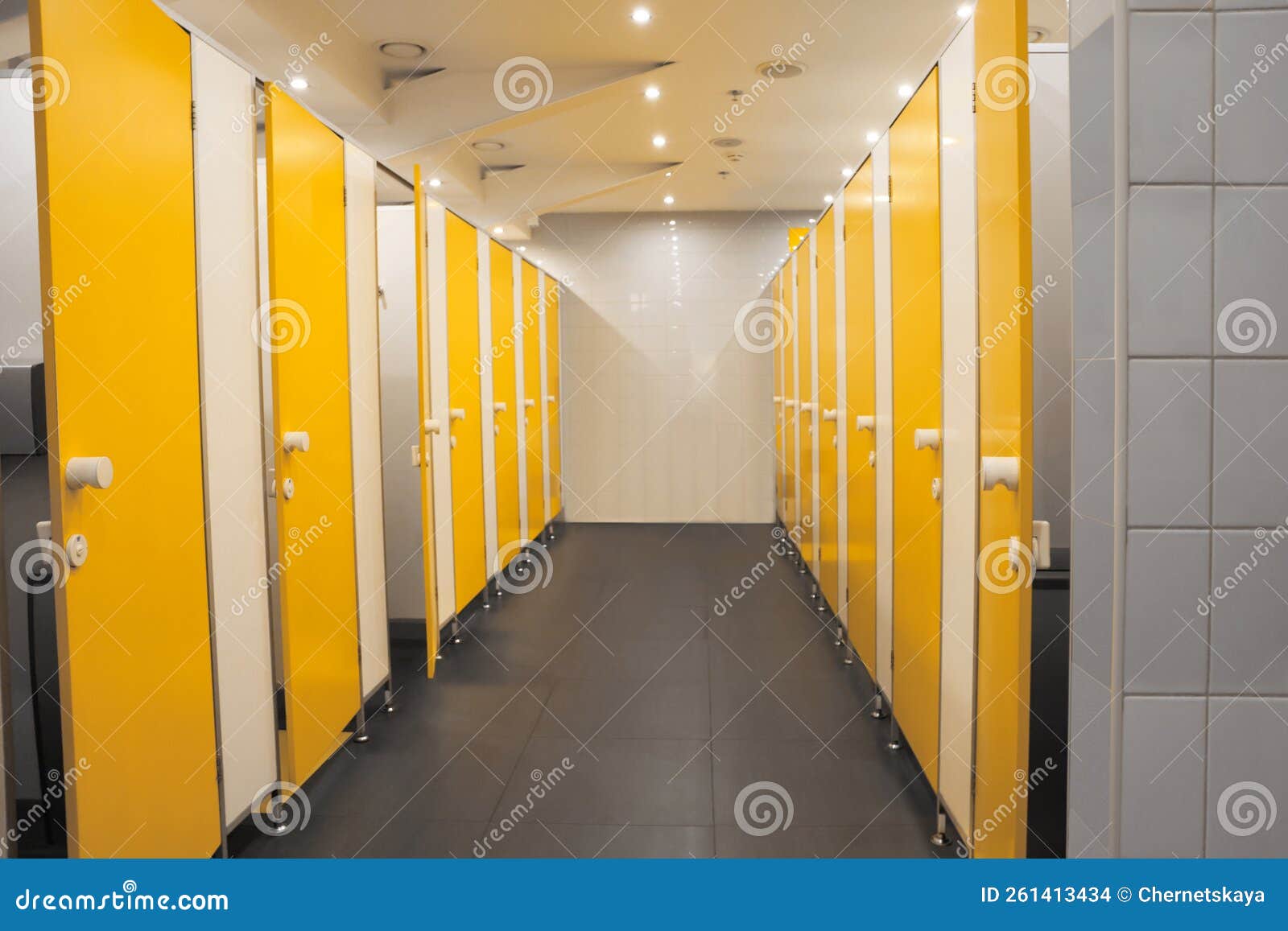 Public Toilet Interior with Bright Yellow Stalls Stock Photo - Image of ...