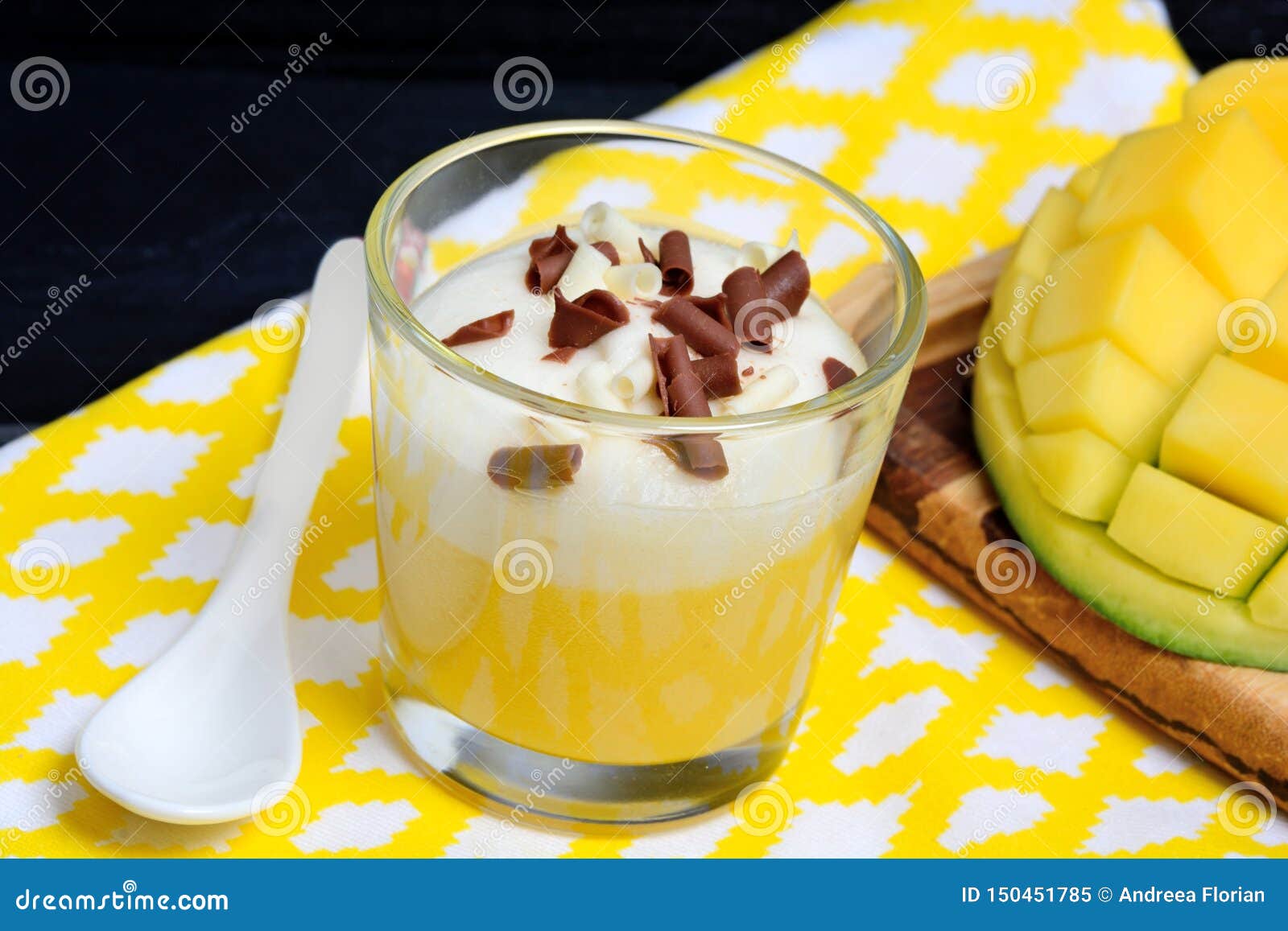Pudding of Mango with Whipped Cream and Chocolate in a Glass Jar on ...