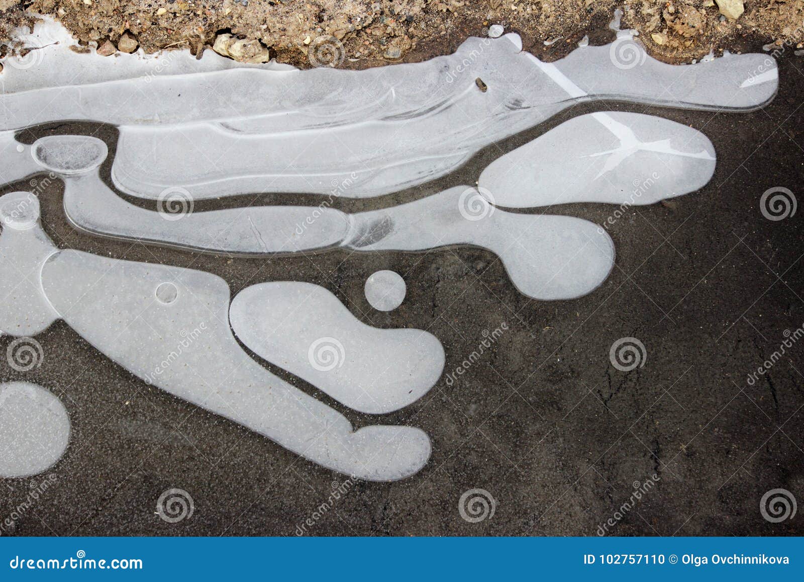 Puddle, Covered with Ice with Frozen Bubbles in Winter. Interesting ...