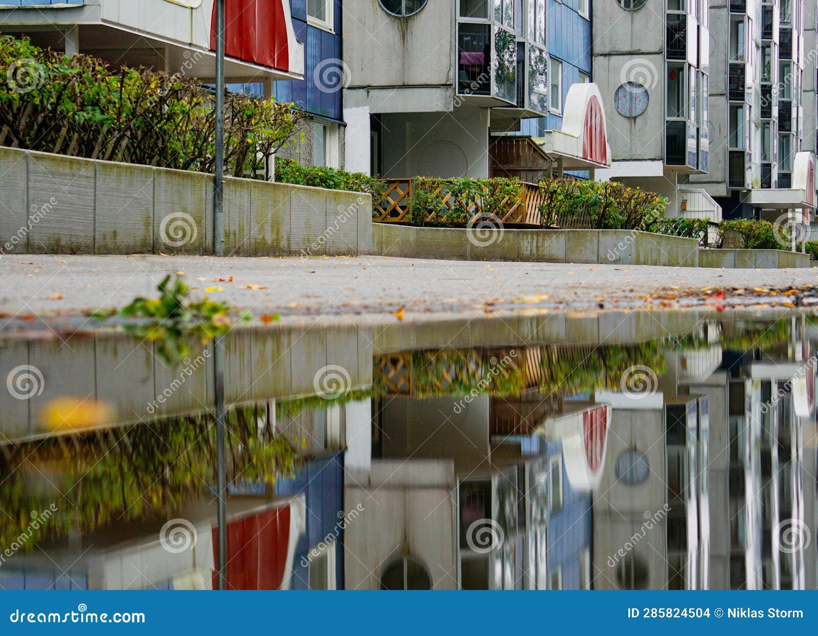 A Puddle in Front of a Building Stock Photo - Image of urban, travel ...