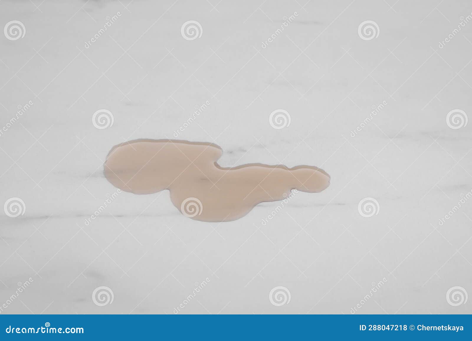 Puddle of Liquid on White Marble Table, Top View Stock Photo - Image of ...