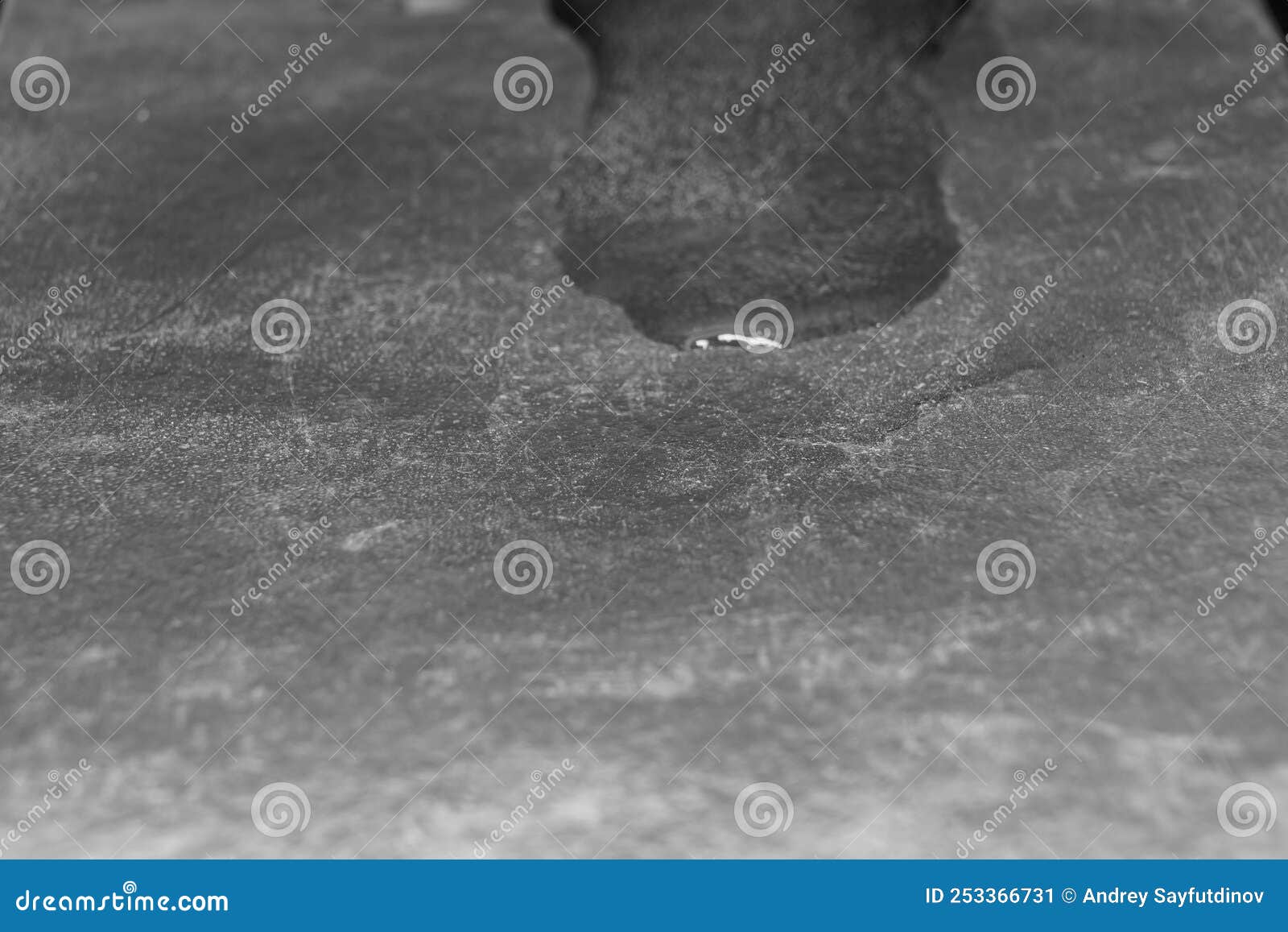 Puddle after Melting an Ice Cube. Black-and-white Stock Image - Image ...
