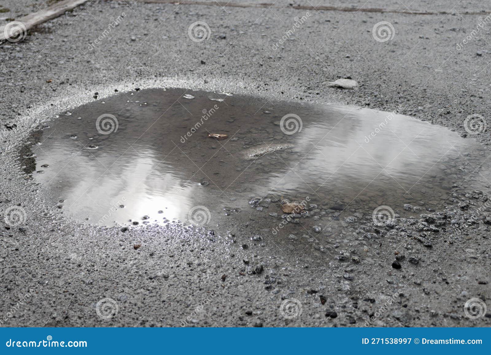 Puddle on the Road, Reflecting the Clouds. Stock Image - Image of water ...