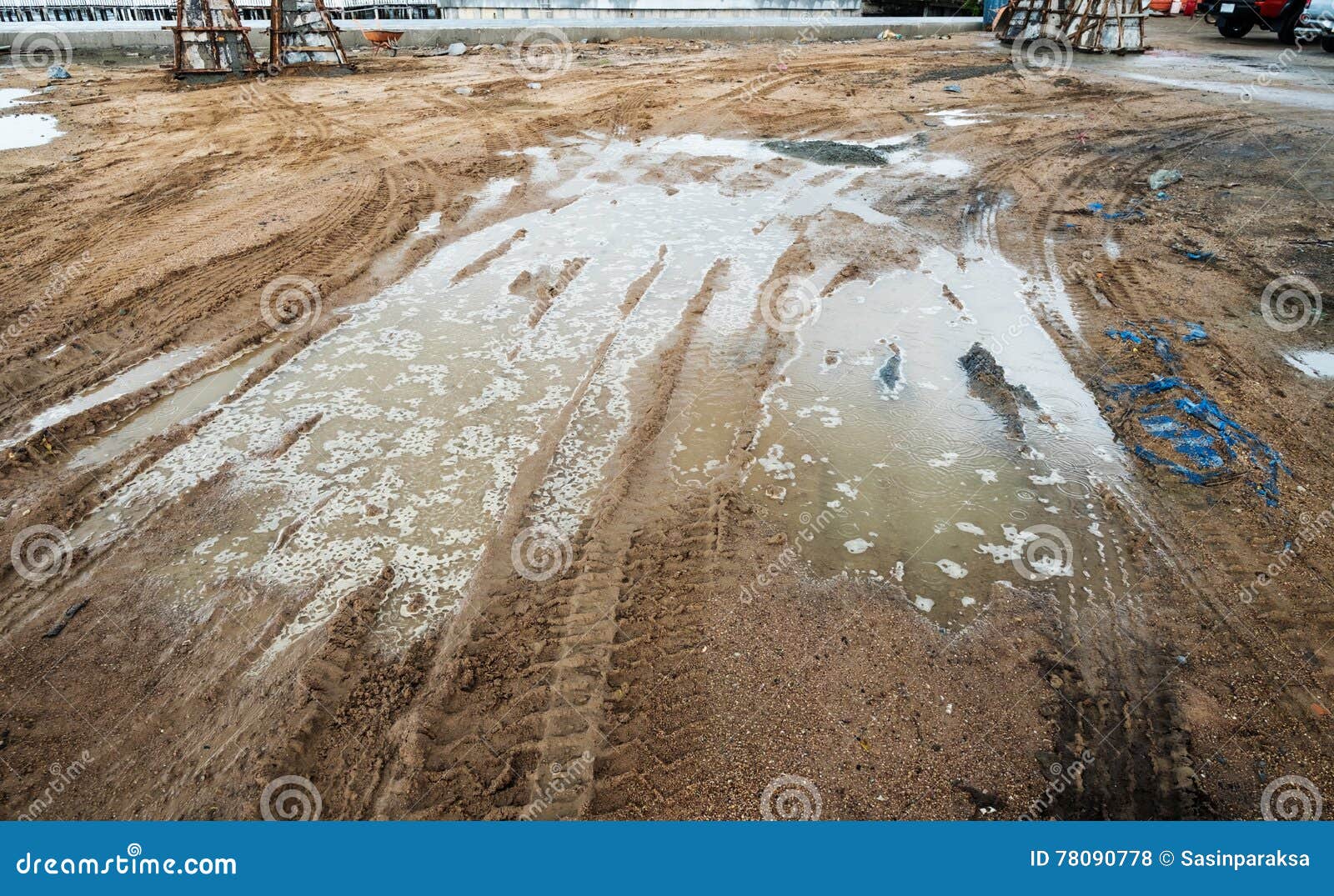 Puddle And Mud With Truck Wheel Track At Construction Site In Rainy Day ...