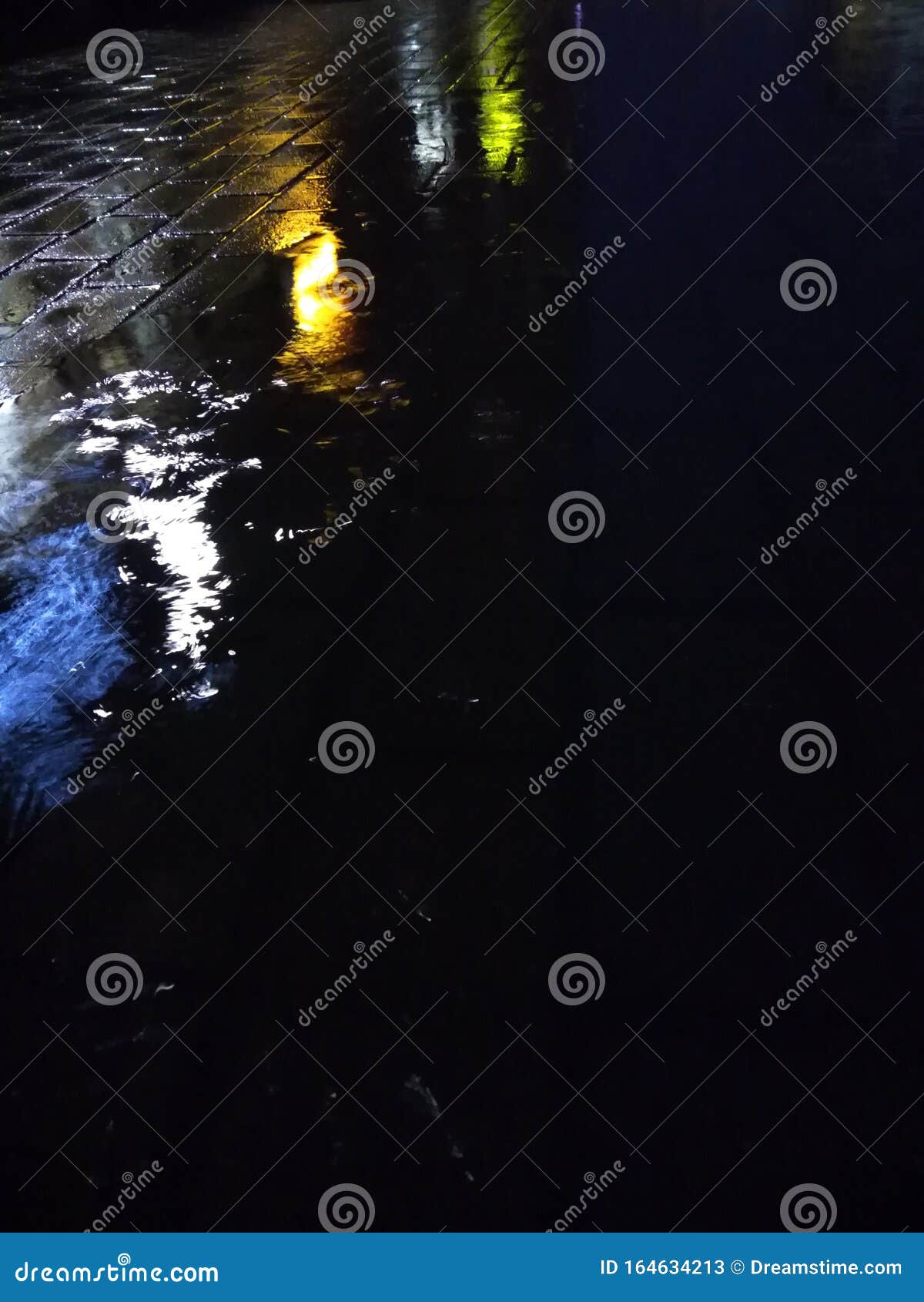 Puddle at Night on a Tiled Road in the City Stock Image - Image of ...